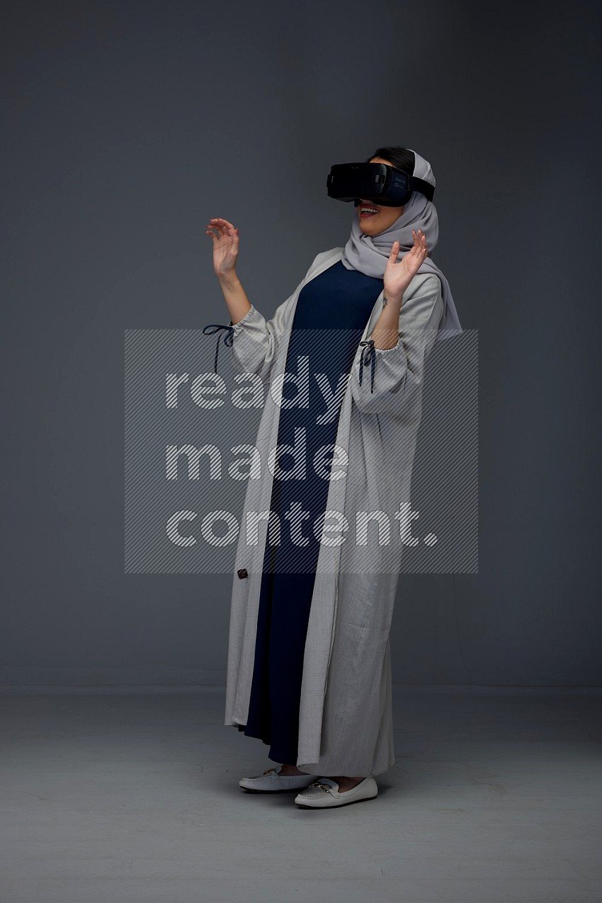 A Saudi woman wearing VR